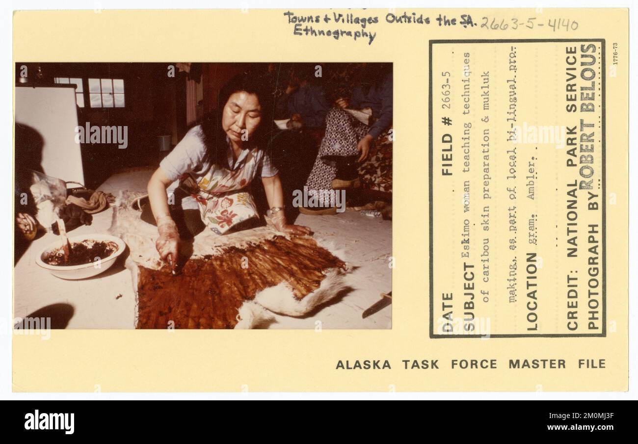 Eskimo woman teaching techniques of caribou skin preparation & mukluk ...