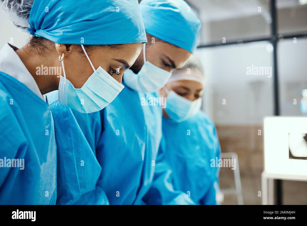 Mask, surgery and team working in hospital for healthcare, patient ...