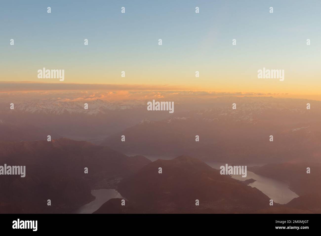 Aerial view of Lake Como, Lake Ceresio and the Alps in the pinkish and ...