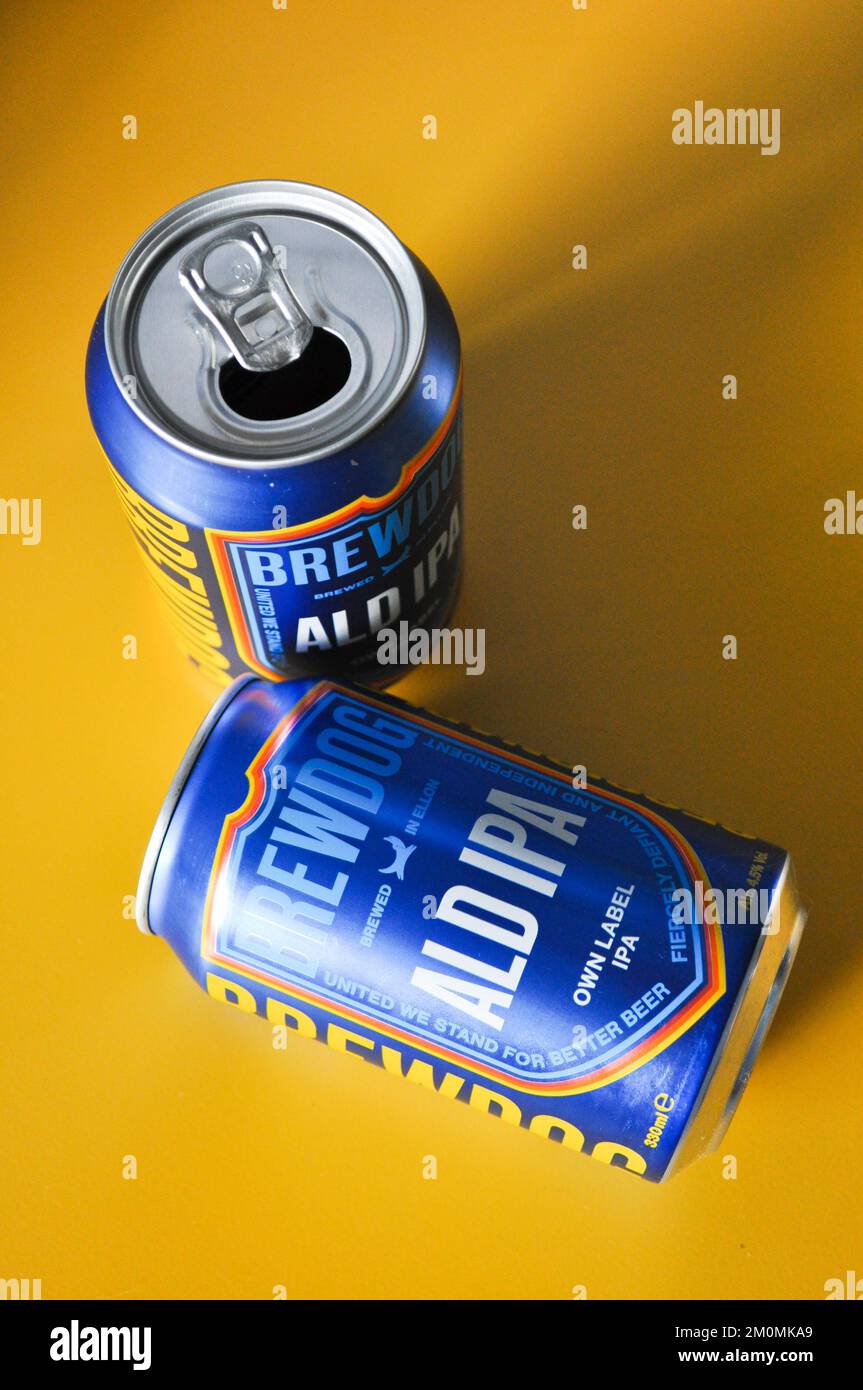 Two empty cans of Brewdog ALD IPS beer isolated against a yellow ...