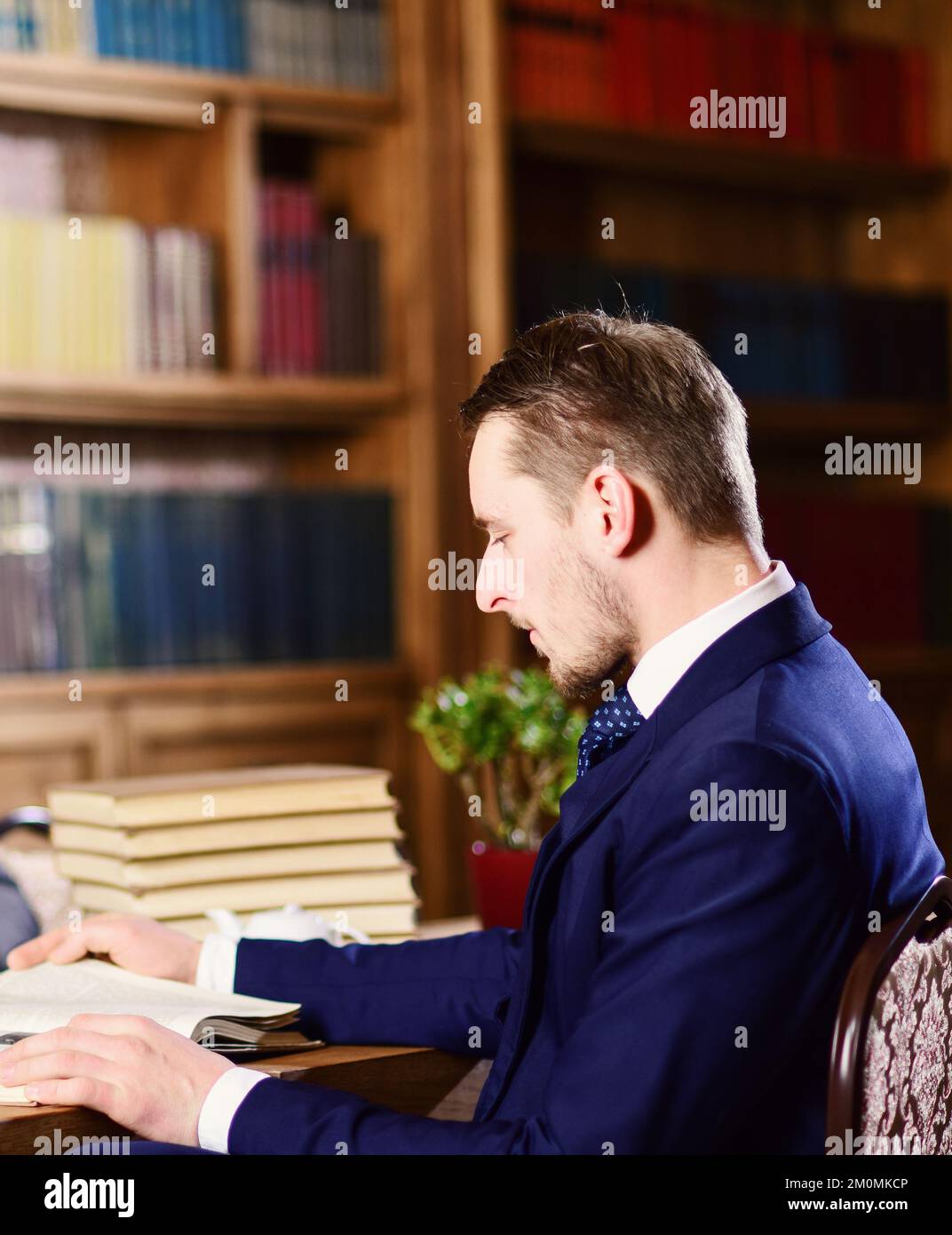 Science and studying concept. Man study in old library Stock Photo - Alamy