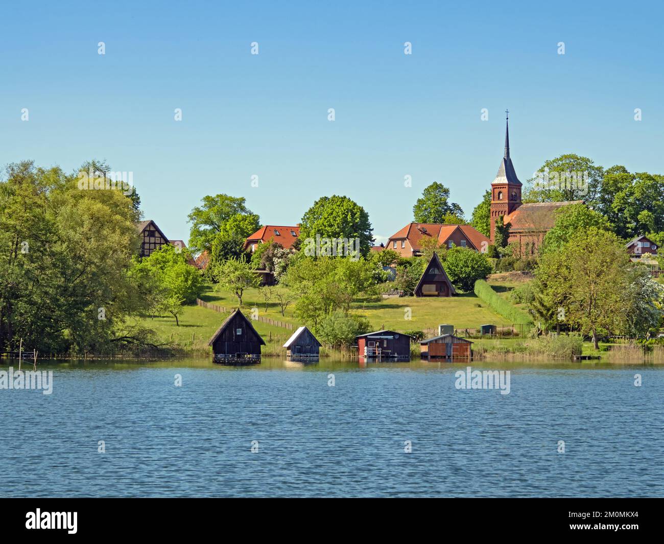 View of the village Wustrow at the Plätlinsee in the Mecklenburg Lake ...
