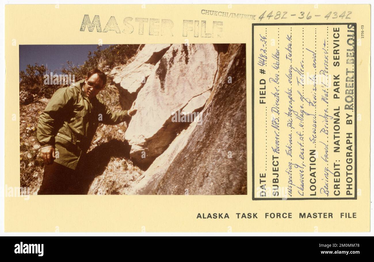 Former NPS Director Ron Walker inspecting Eskimo pictographs along ...