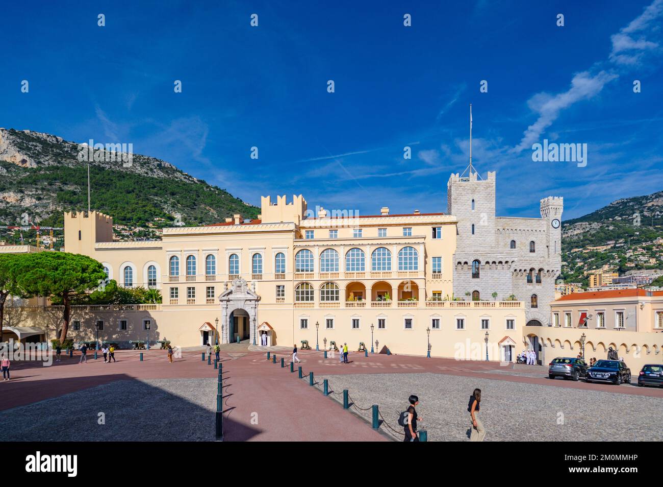 The Prince's Palace of Monaco front view in a blue morning people ...