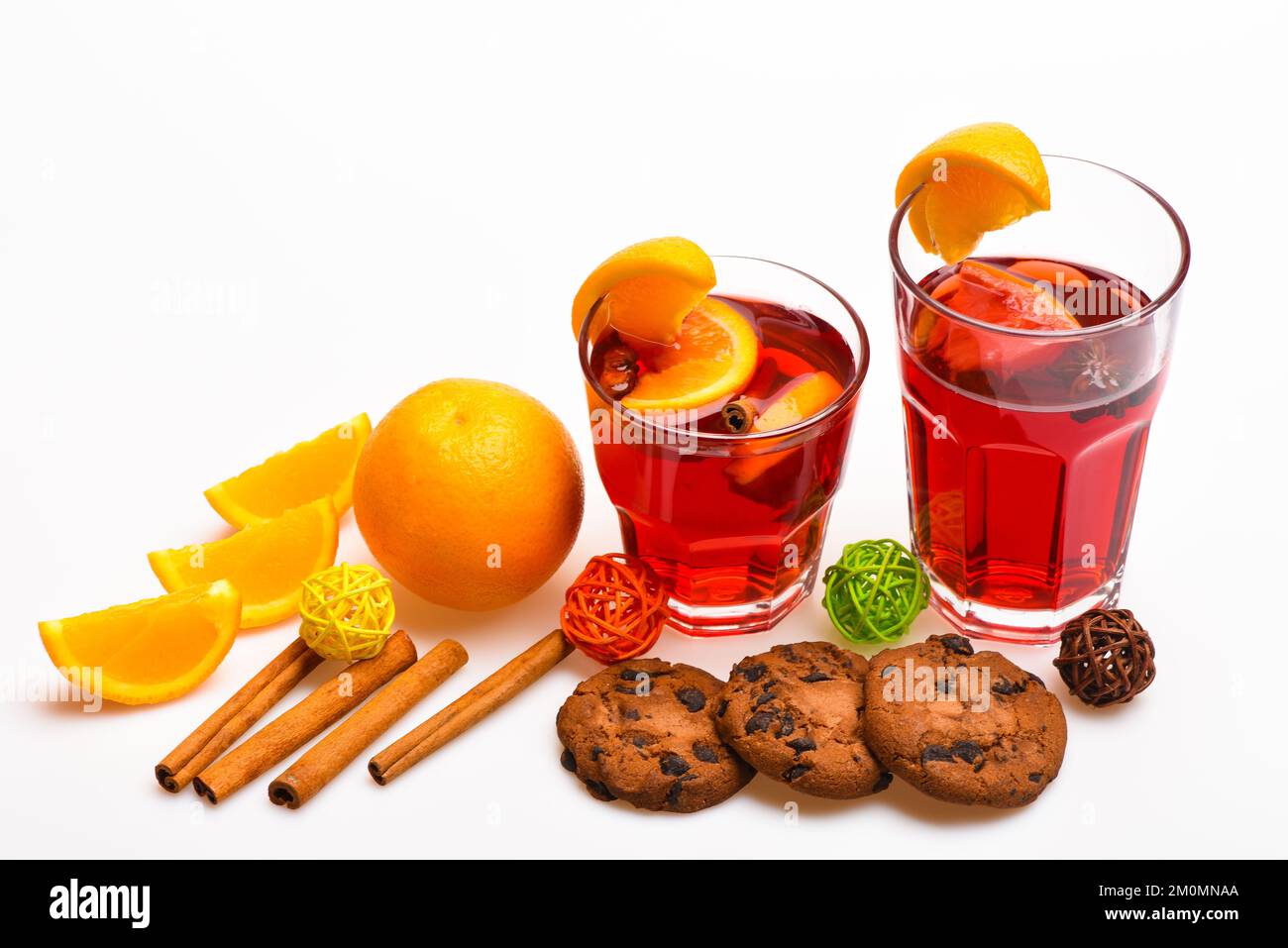 Drink of season concept. Glasses with hot drink near juicy orange fruit ...