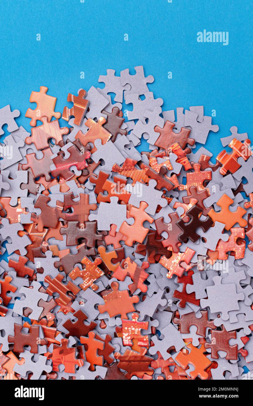 Mixed Peaces of a Colorful Jigsaw Puzzle Lie on the Blue Background ...