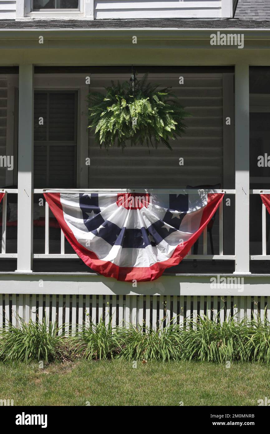 Traditional patriotic American flag banner displayed on a colonial ...