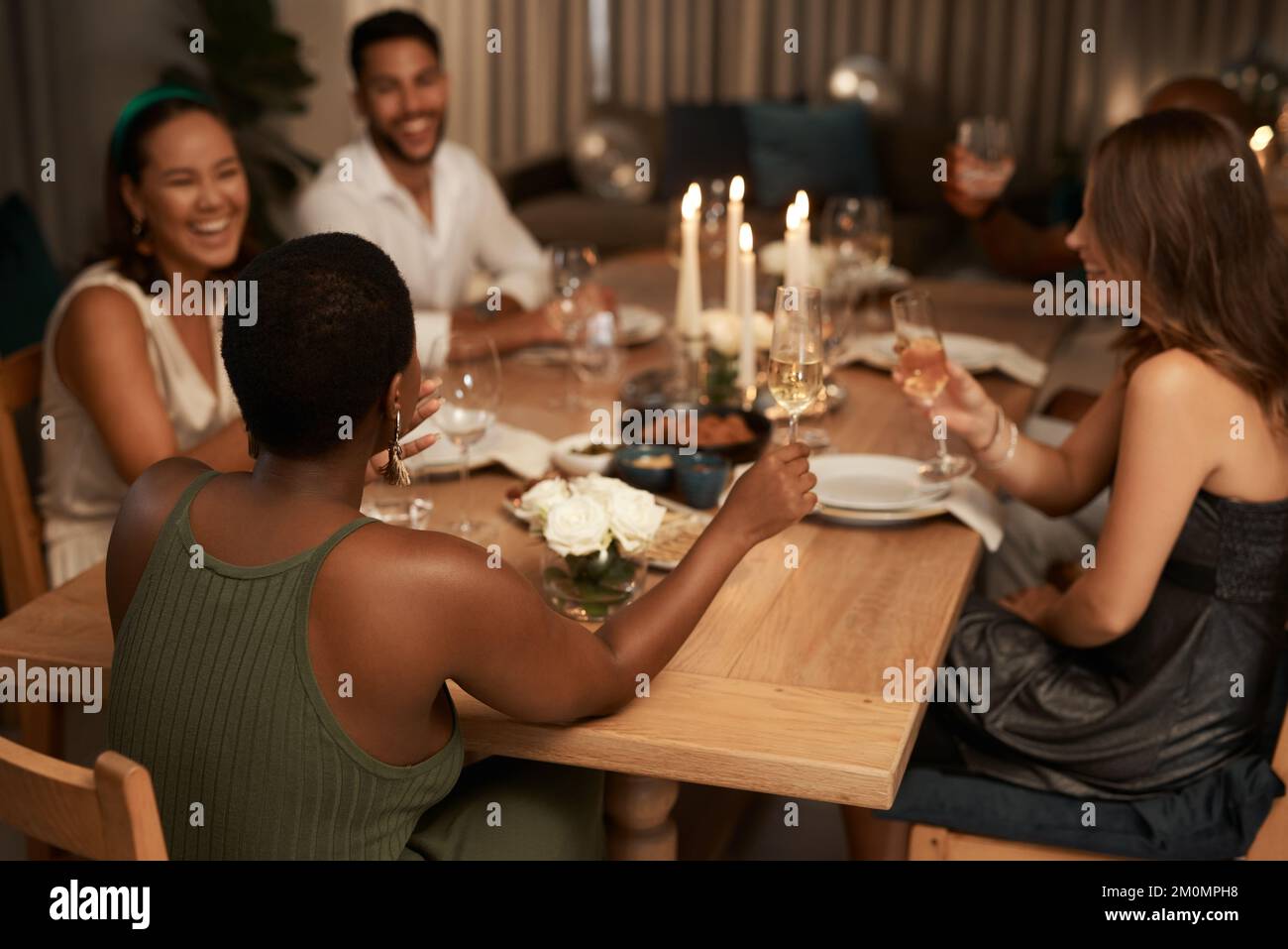 People laughing at dinner table hi-res stock photography and images - Alamy