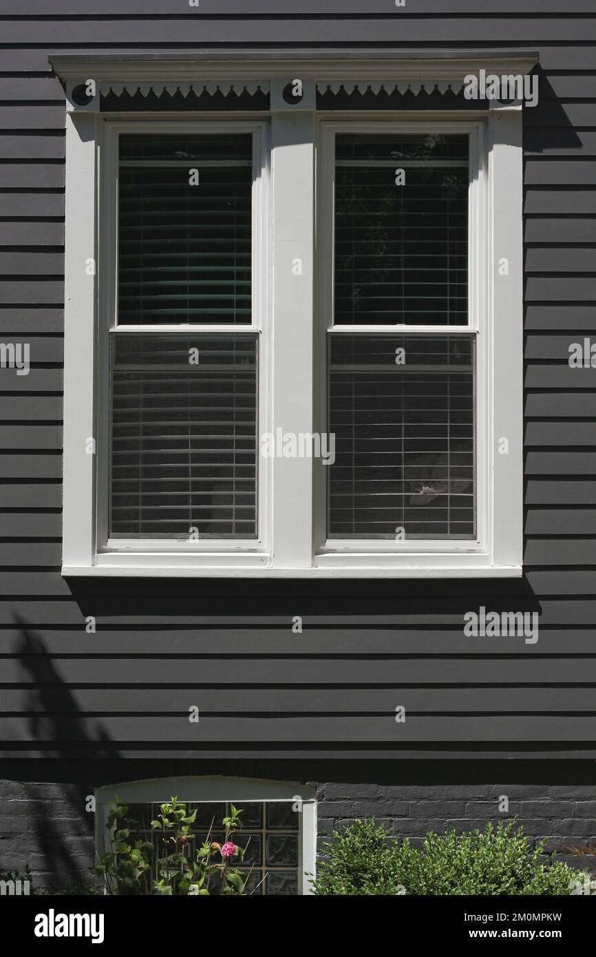 Traditional wooden cottage window on the wall of a house Stock Photo ...