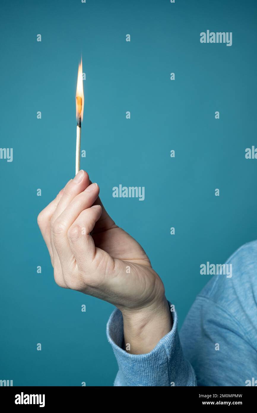 Match flame blue background hi-res stock photography and images - Alamy