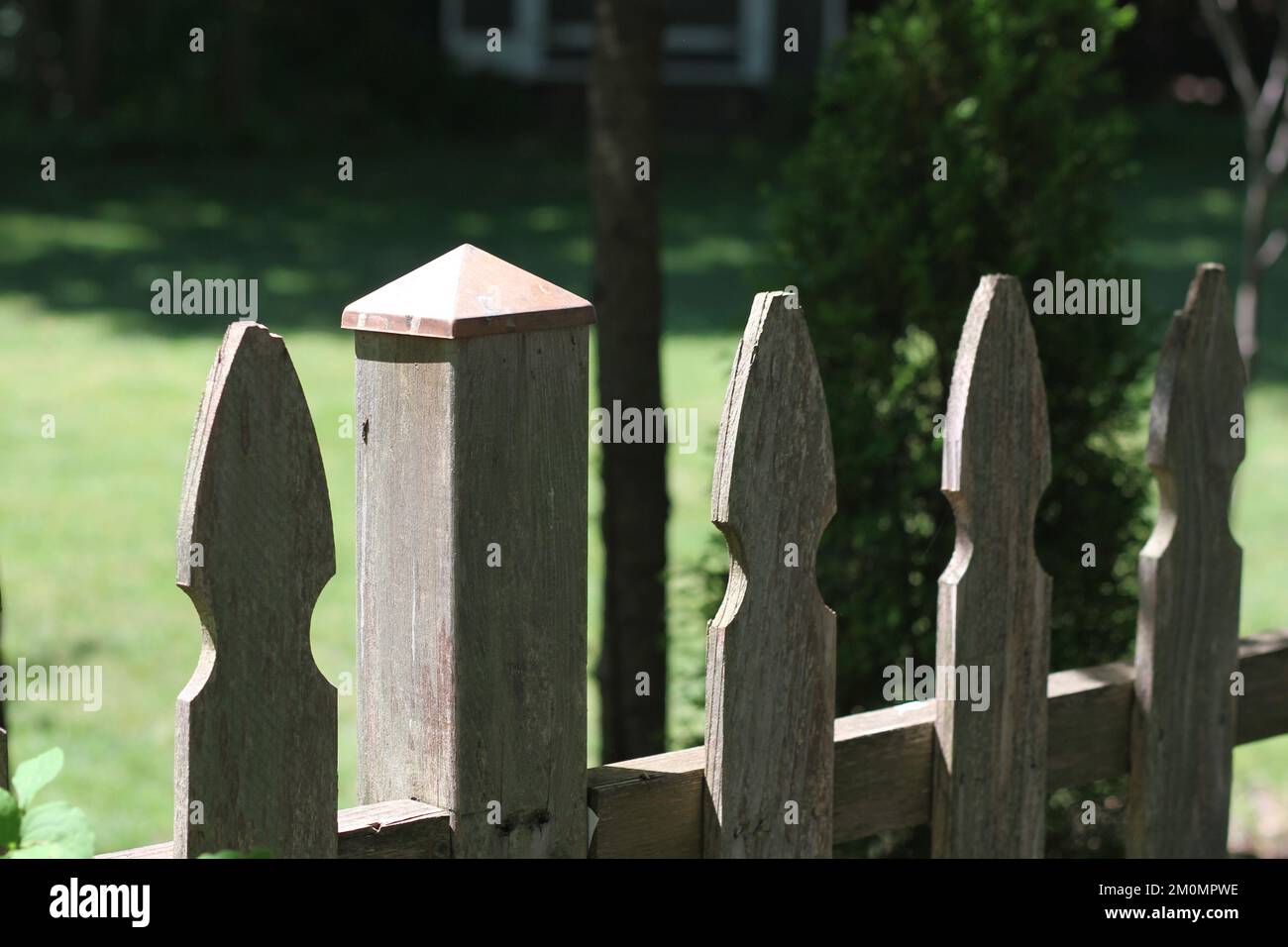 Traditional vintage wooden picket fence surrounding the garden Stock ...