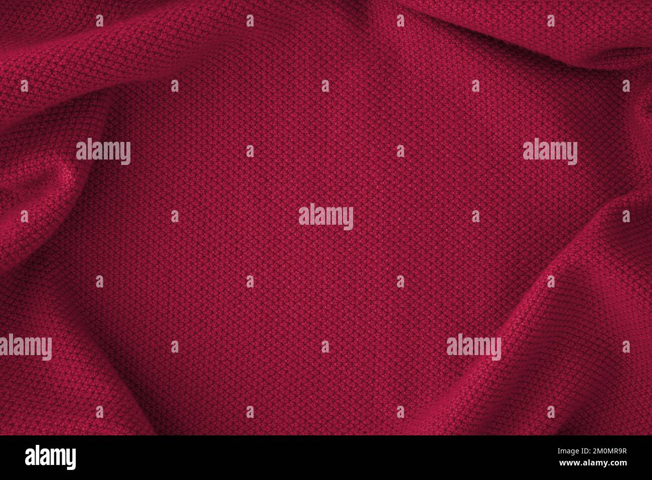 Texture of knitted fabric in trendy Magenta color Stock Photo - Alamy