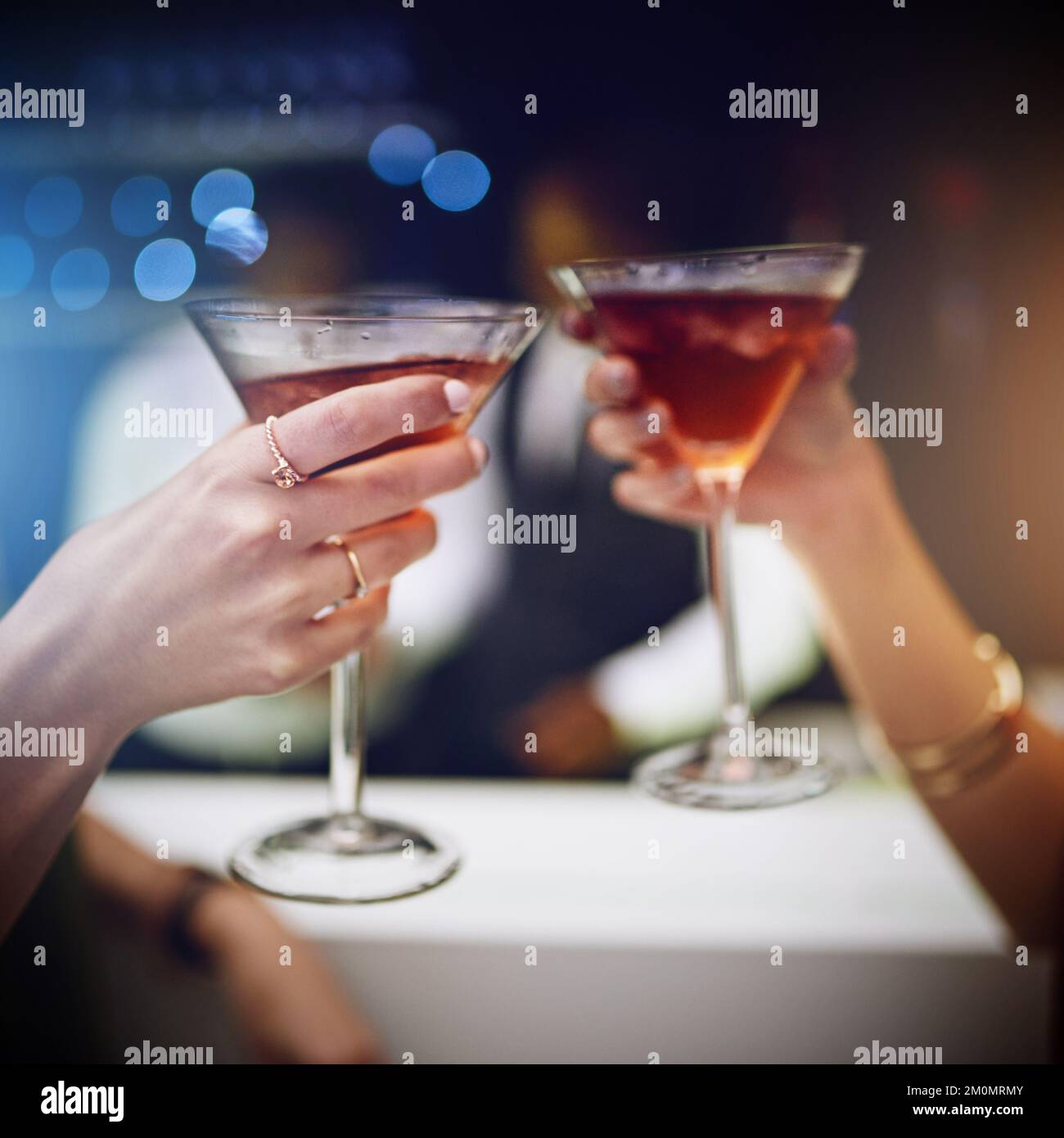 Hands, cocktail and party with friends drinking together in a nightclub ...