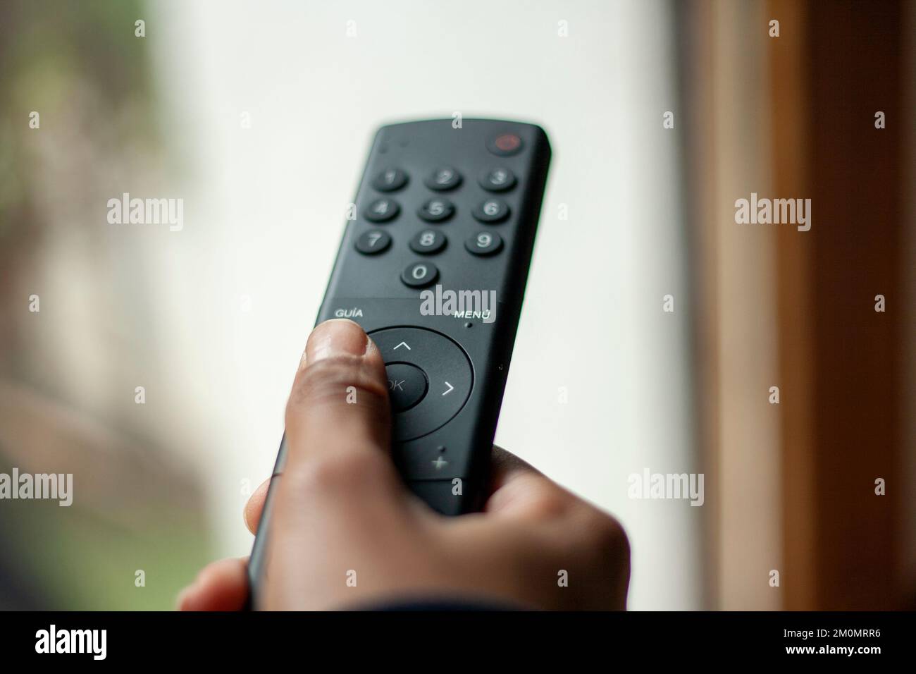 hand directing a television remote where you can see the different ...