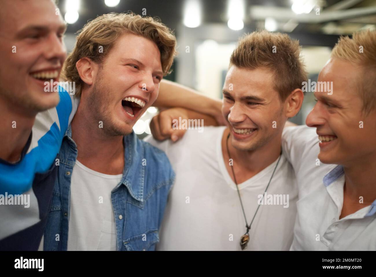 Happy, men and friends hug at event with excited smile for group ...