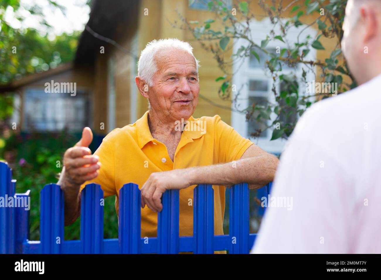 Standing beside house man hi-res stock photography and images - Alamy
