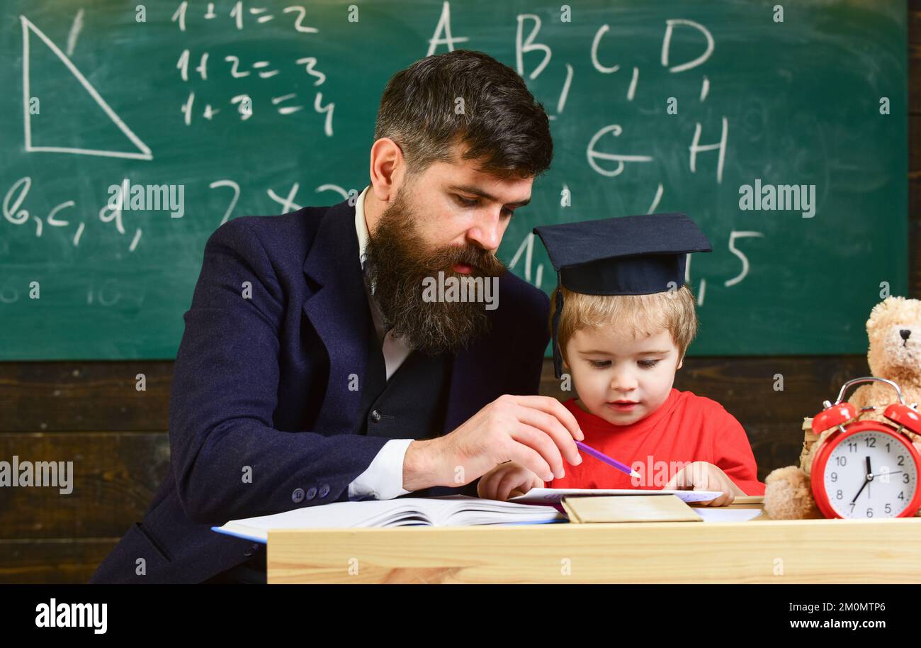 Kid studies individually with teacher, at home. Individual schooling ...