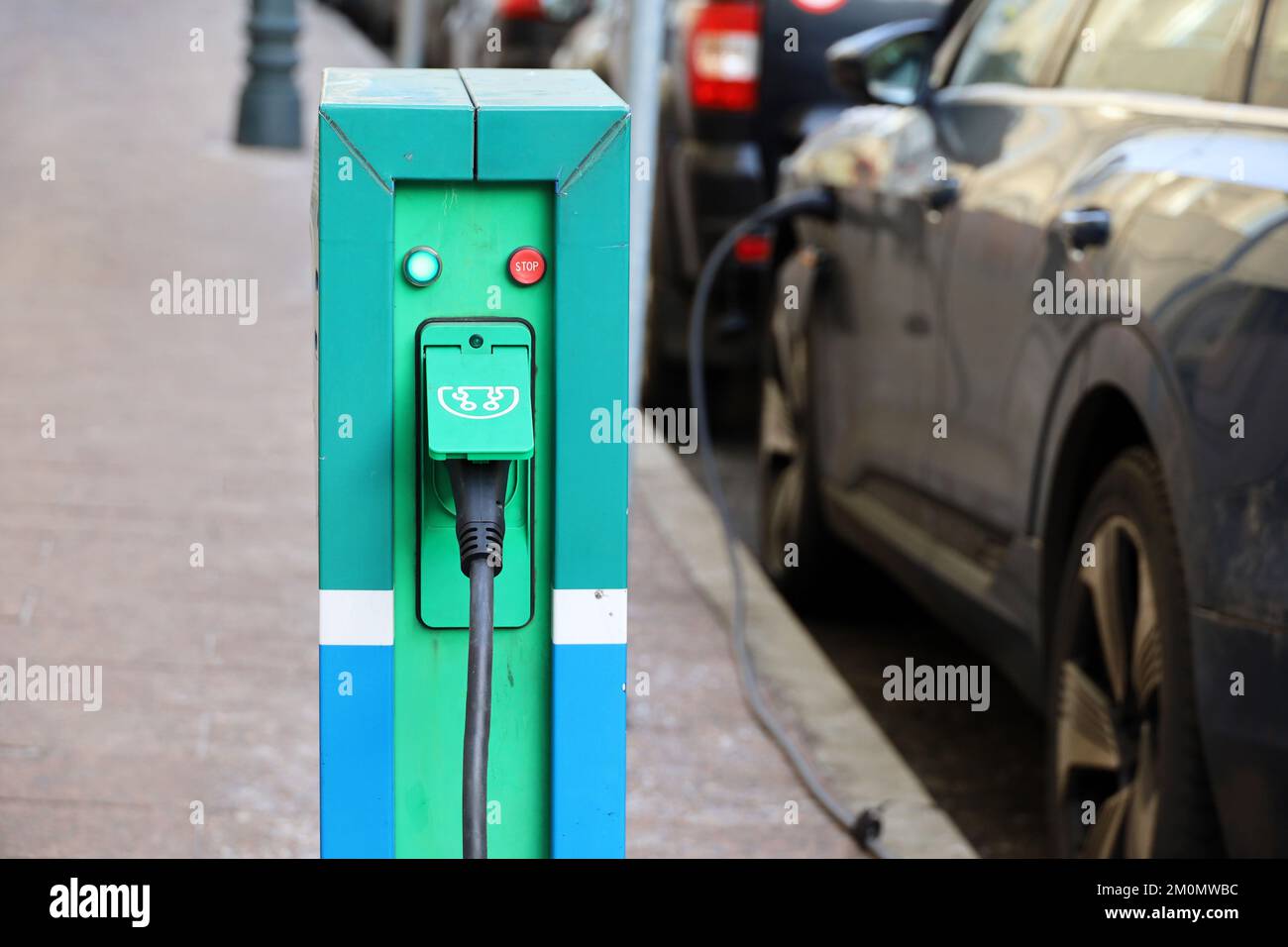 Electric car charging, eco-friendly transport. Charging station on a ...