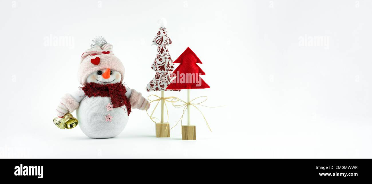 Handmade Cute snowman holding jingle bells and creative Christmas trees ...
