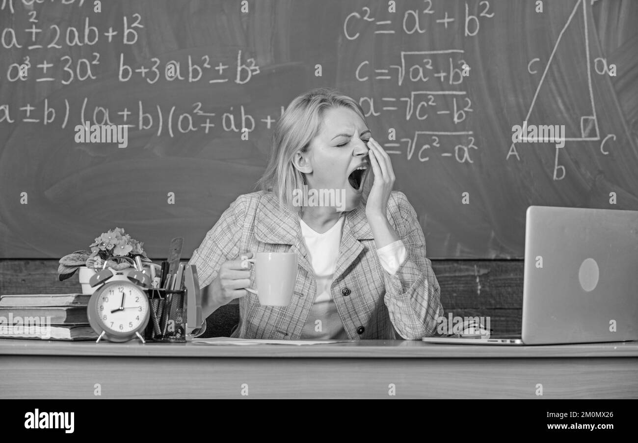 Workaholic sleepy at workplace. Teacher woman sit table classroom ...