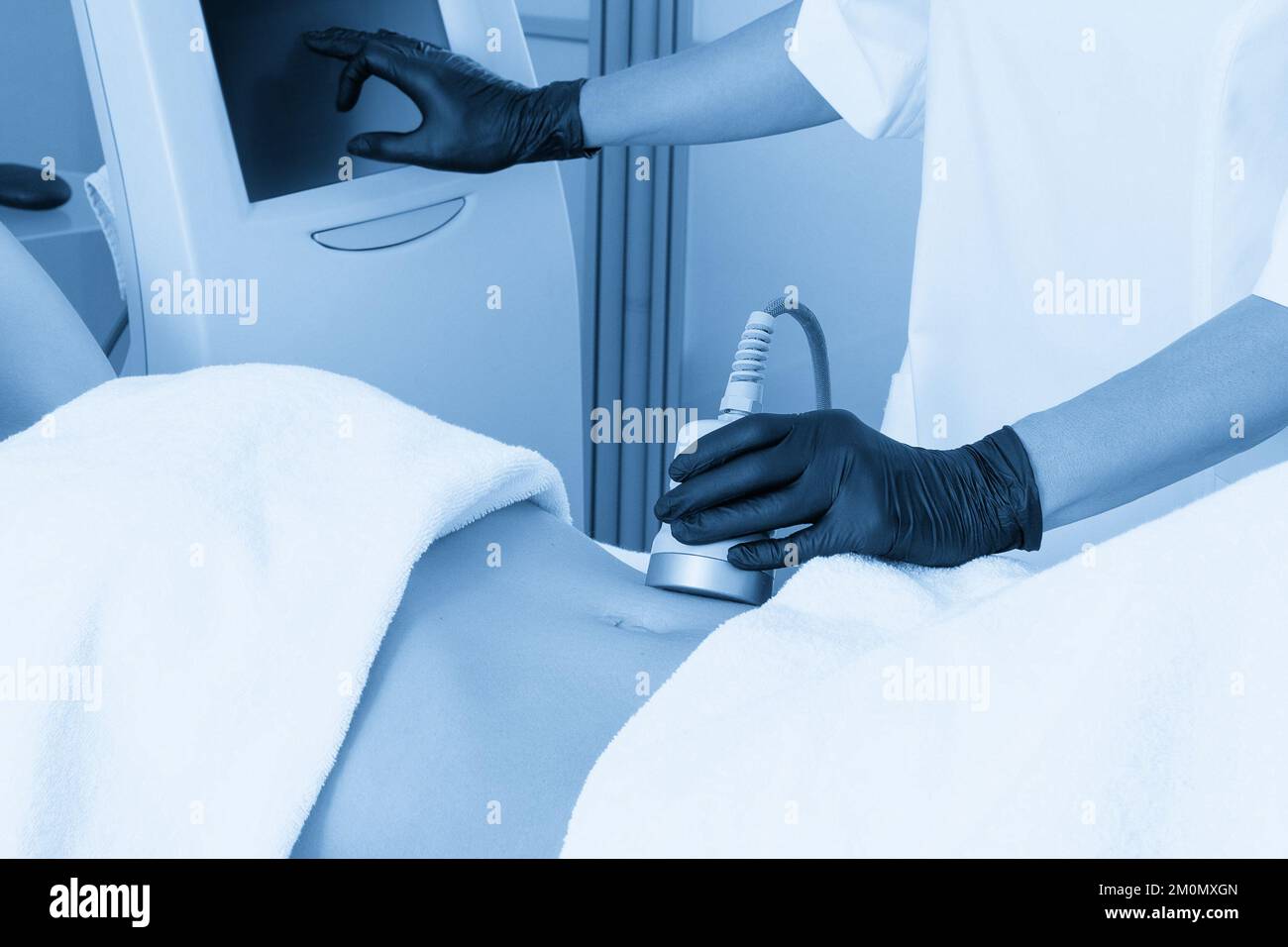 Ultrasound cavitation body contouring treatment. Woman getting anti ...