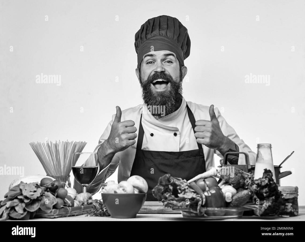 Happy Chef standing over ingredients and showing thumbs up Stock Photo ...