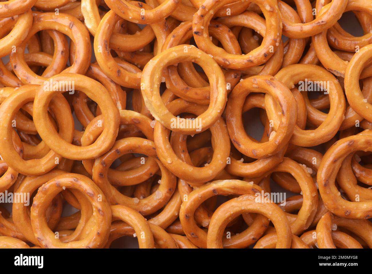Top view of mini salted crispbread rings background Stock Photo - Alamy