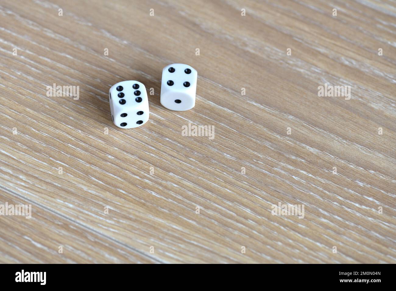 Old dice on a table Stock Photo - Alamy
