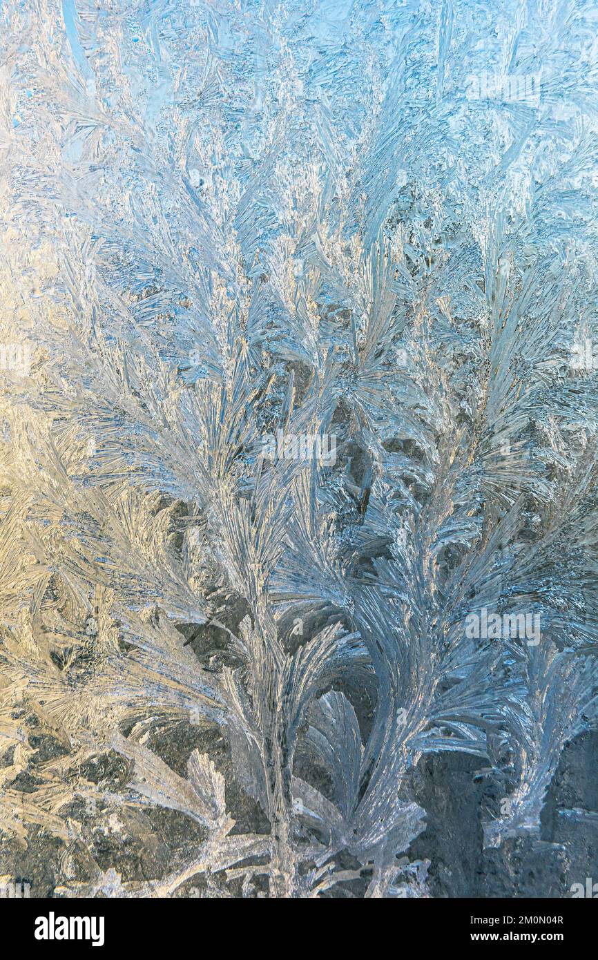 Frozen winter window with shiny ice frost pattern texture. Christmas ...