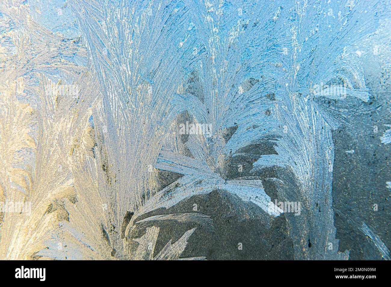 Frozen winter window with shiny ice frost pattern texture. Christmas ...