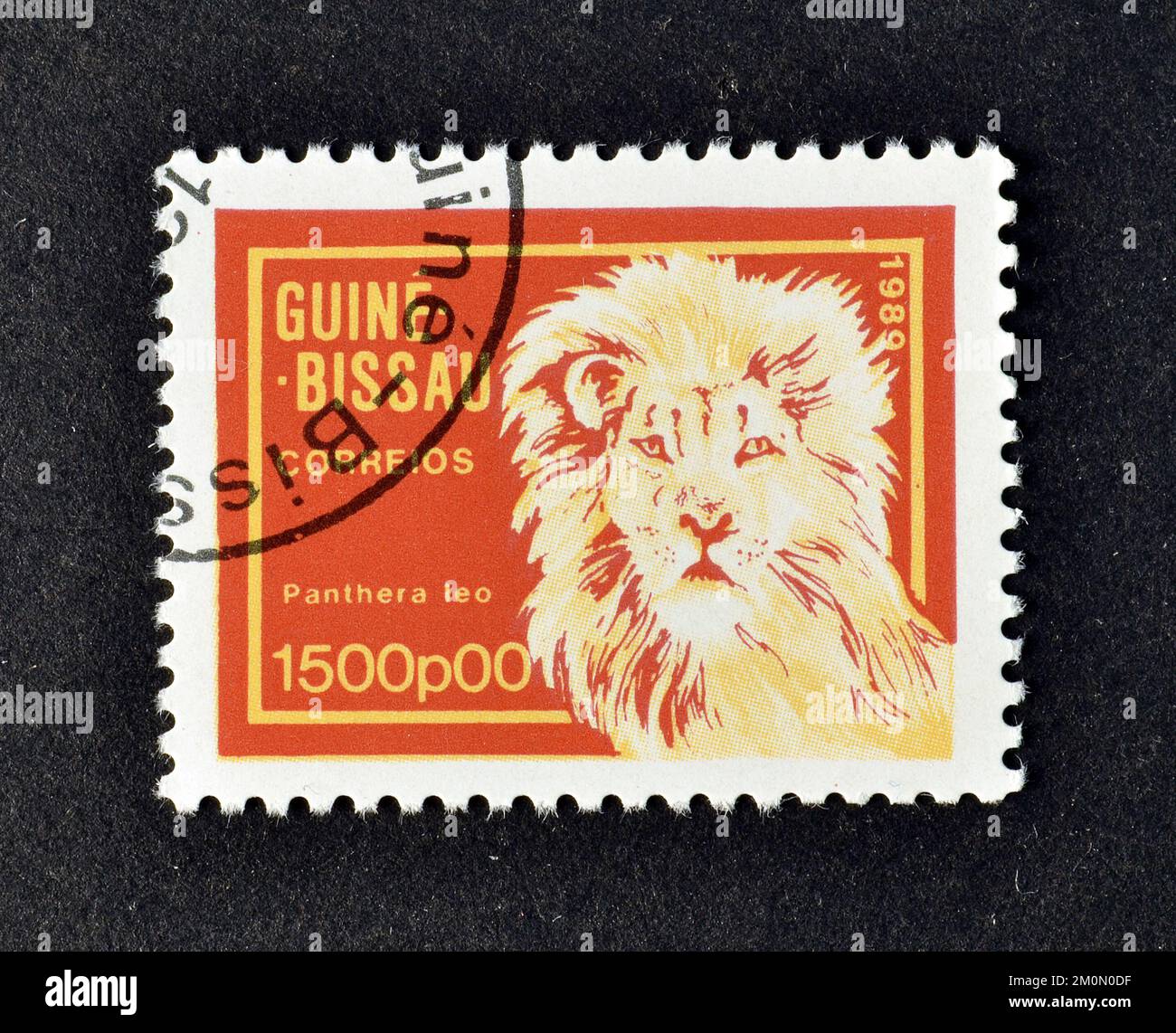 Cancelled postage stamp printed by Guinea Bissau, that shows Lion ...