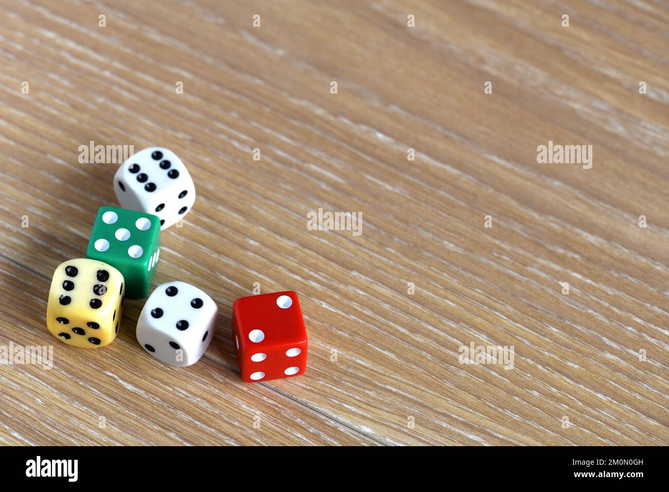 Old dice on a table Stock Photo - Alamy