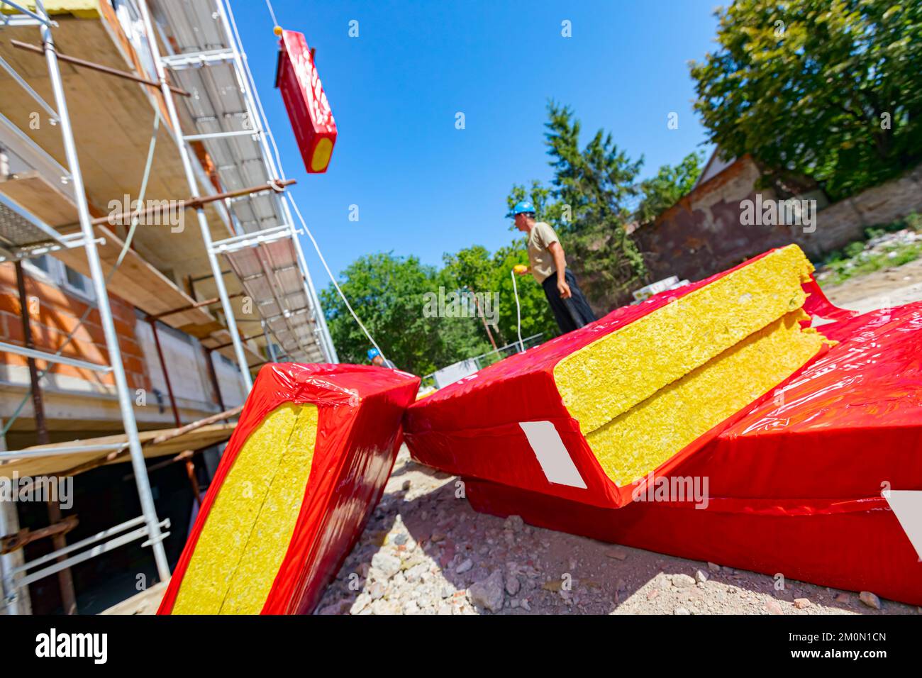 Stack of thermal insulation material is wrapped with cellophane foil ...
