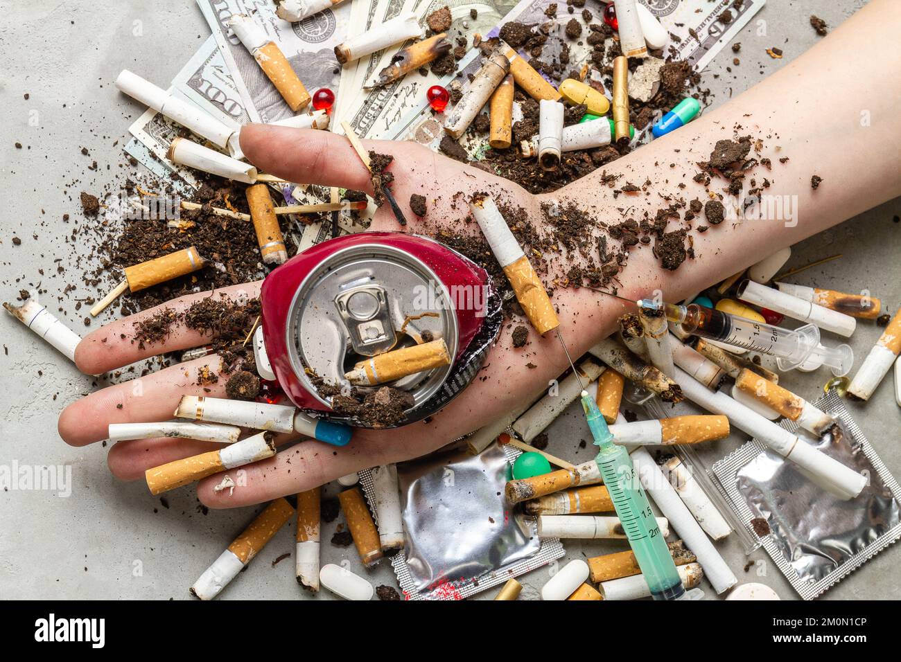 Top view hand holding compressed soda can. Enviroment pollution or drug ...