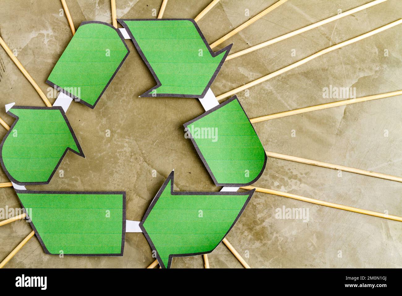 Close up green recycle sign and many wooden sticks. Green world concept ...