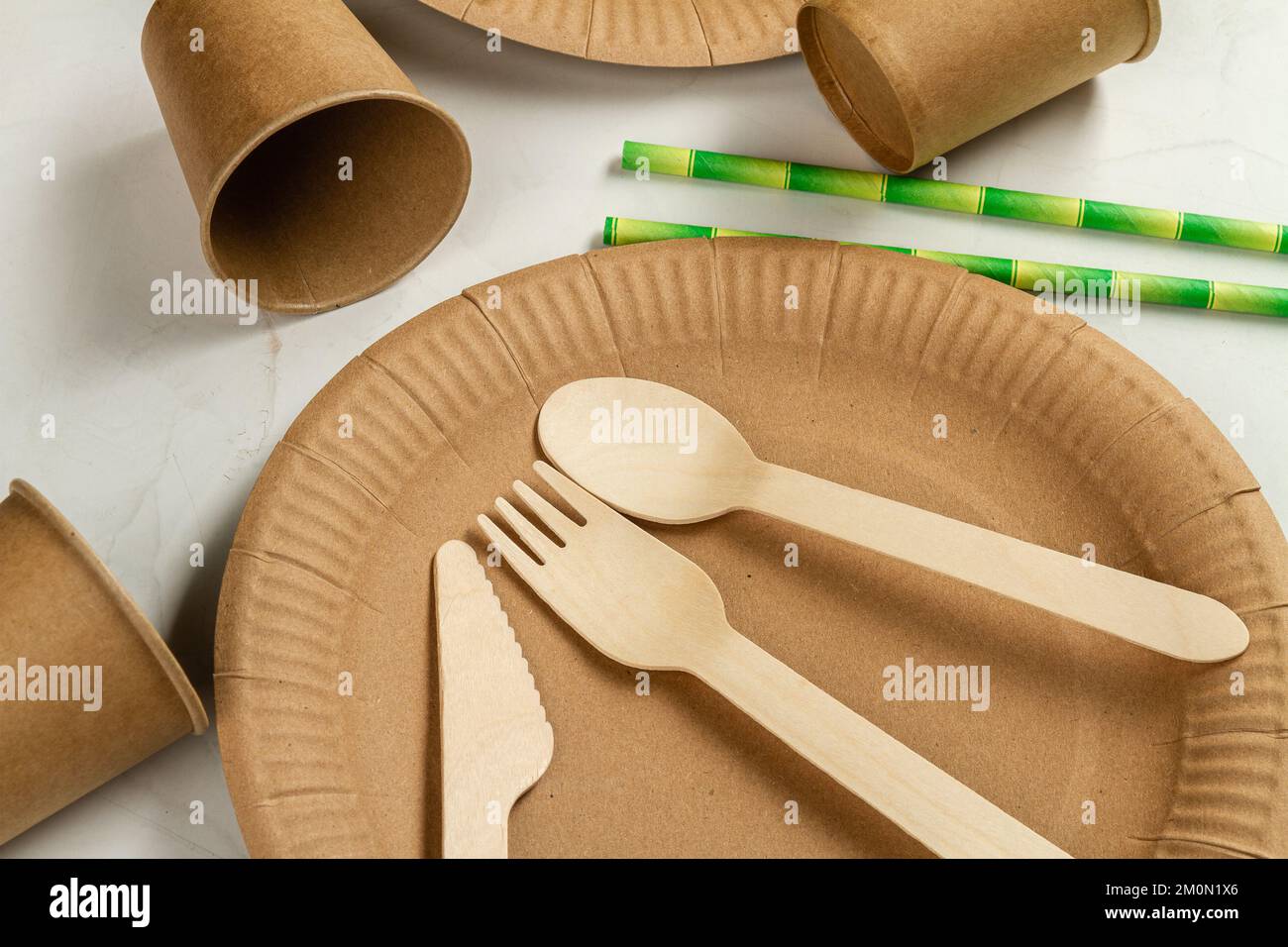 Top view eco paper craft plate and utensils. Fork with knife and spoon ...