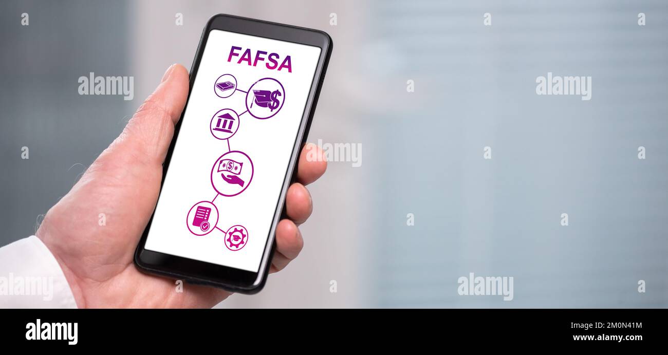 Hand holding a smartphone with fafsa concept Stock Photo - Alamy