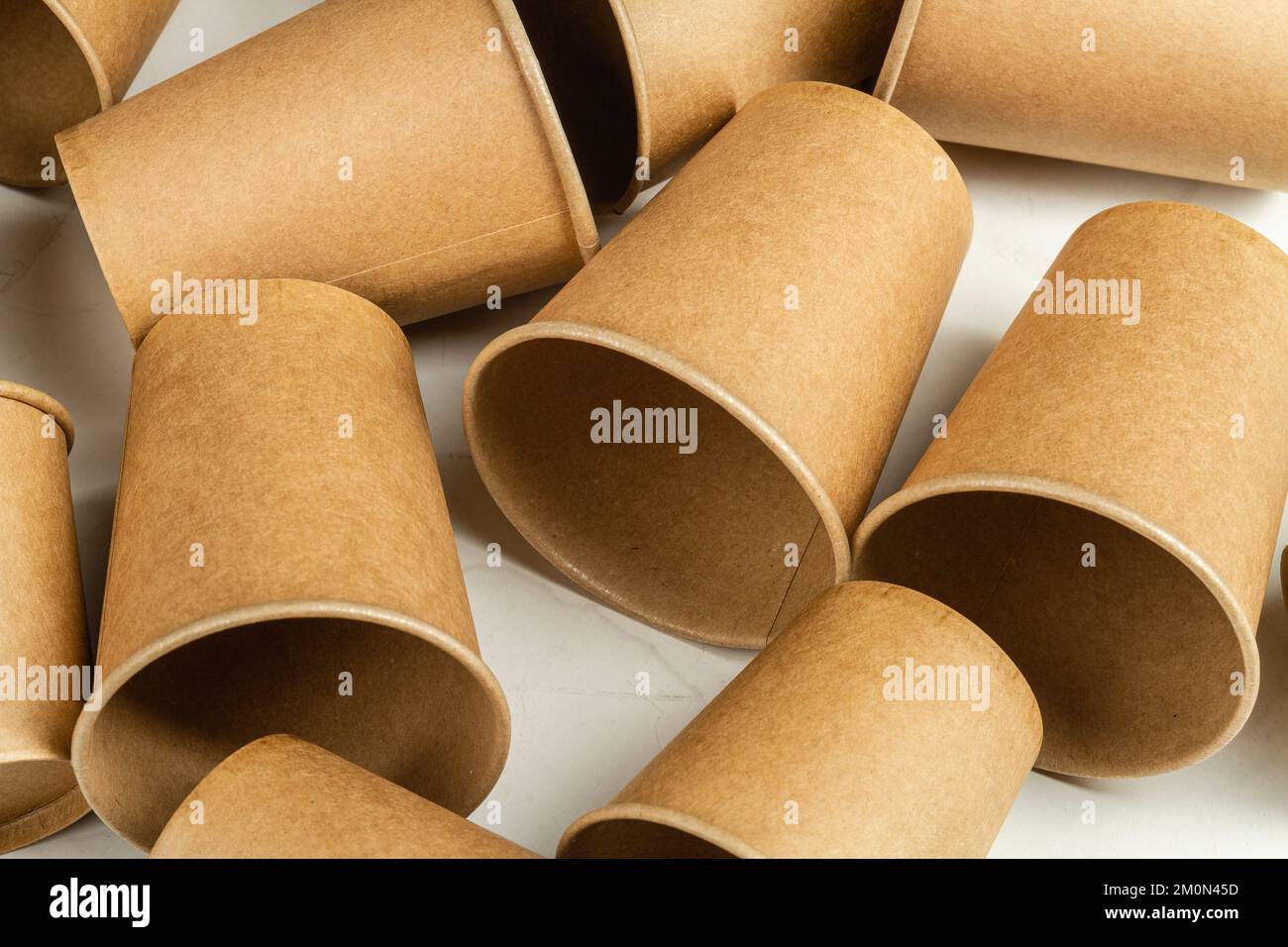 Many brown disposable empty paper cups. Containers for beverage Stock ...