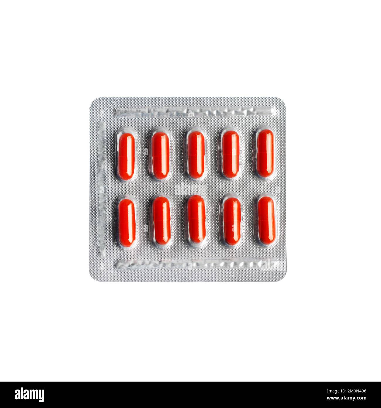 Red pill capsules in blister pack isolated on white background with ...