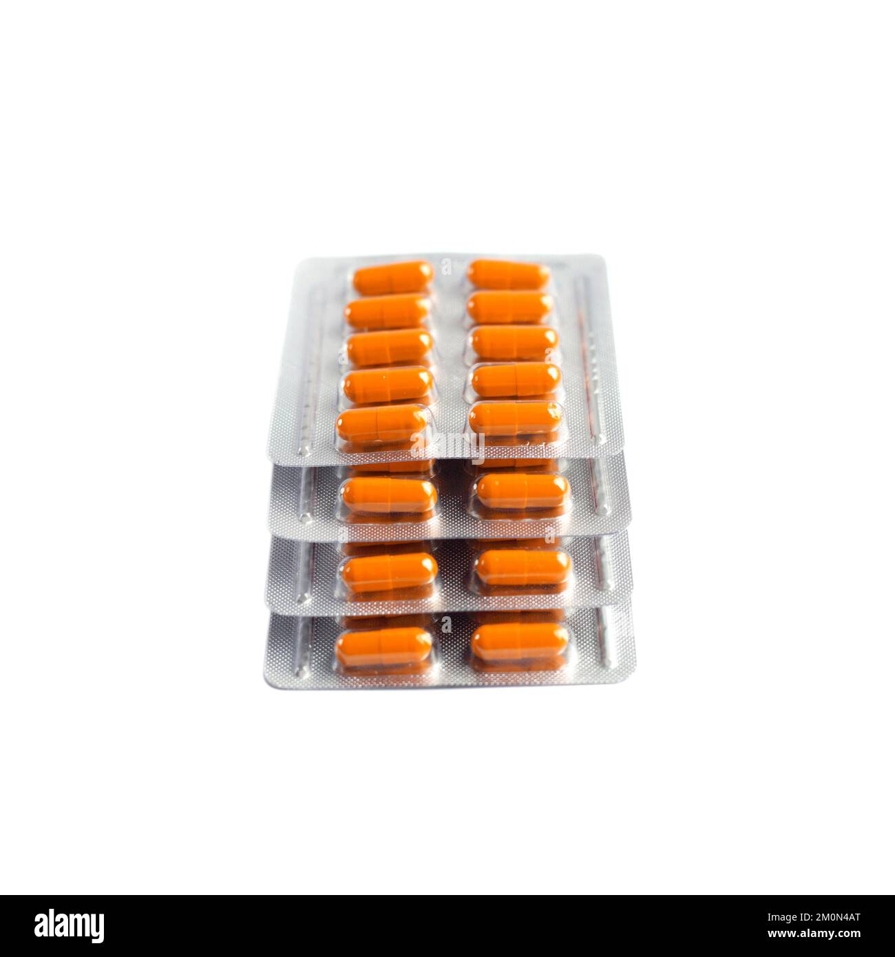 Orange pill capsules in blister packs isolated on white background ...