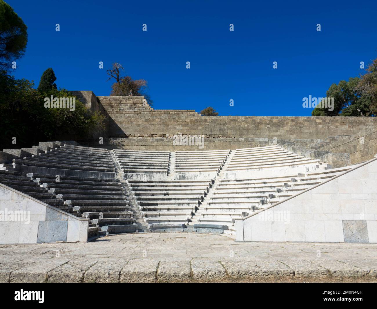 Odeon theater with marble seats and stairs. The Acropolis of Rhodes ...