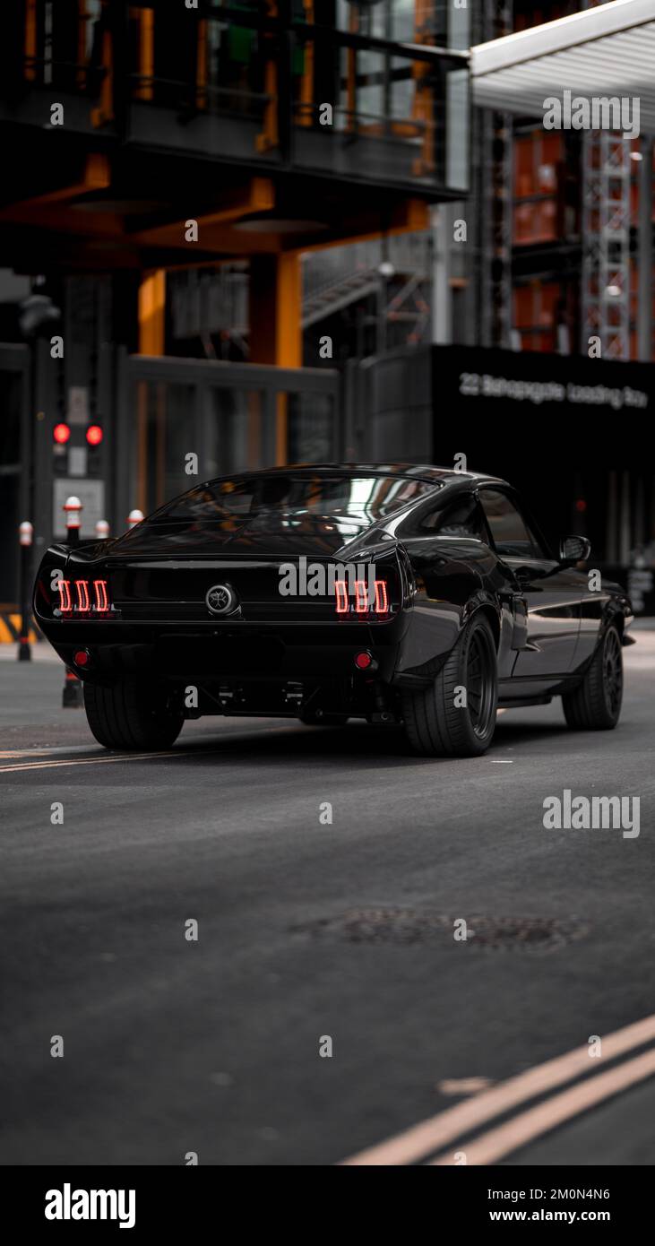 A vertical shot of EV supercar, Mustang electric car in the financial ...