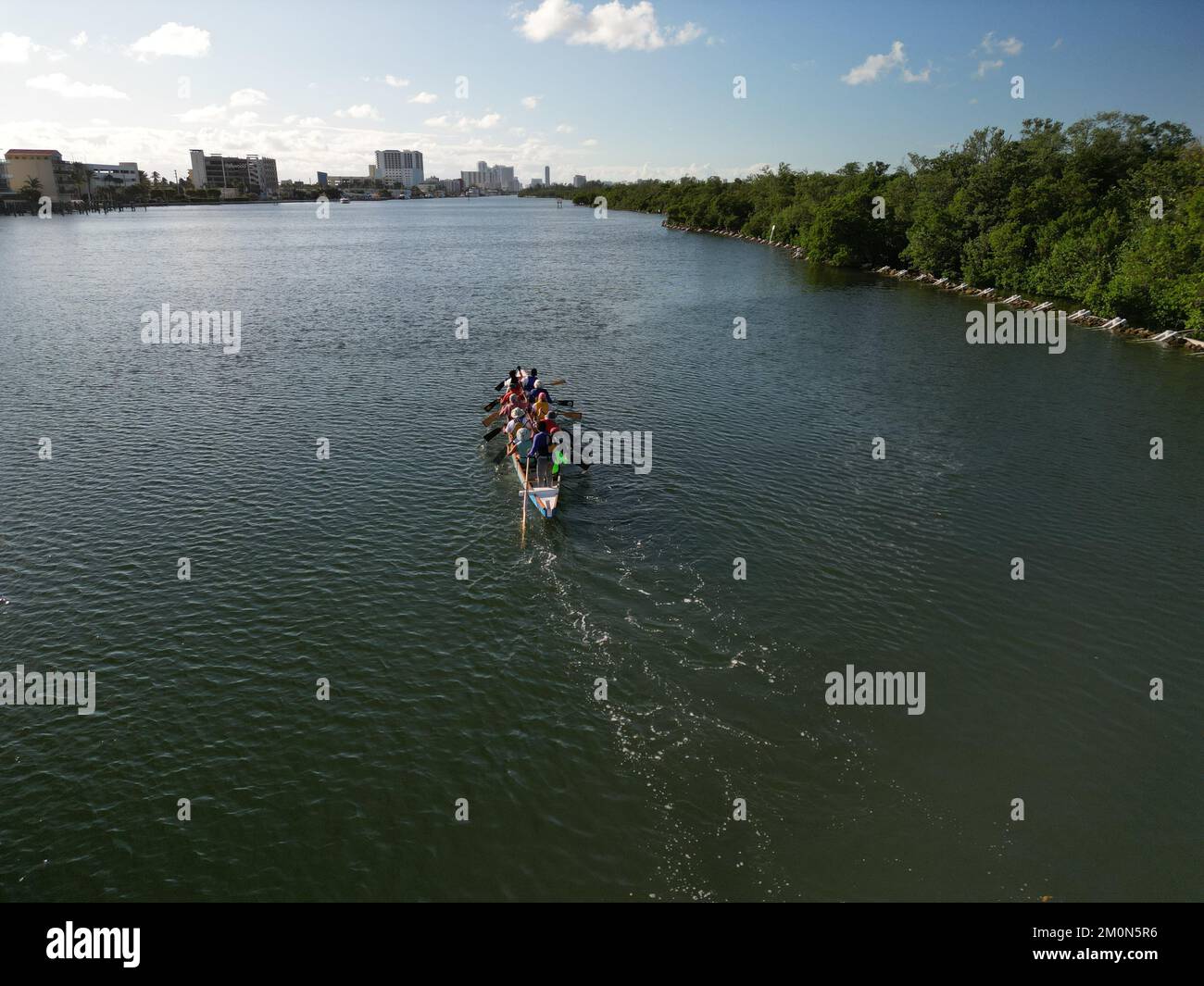 Aerial view of crew rowing or dragon boat racing along the Intracoastal ...