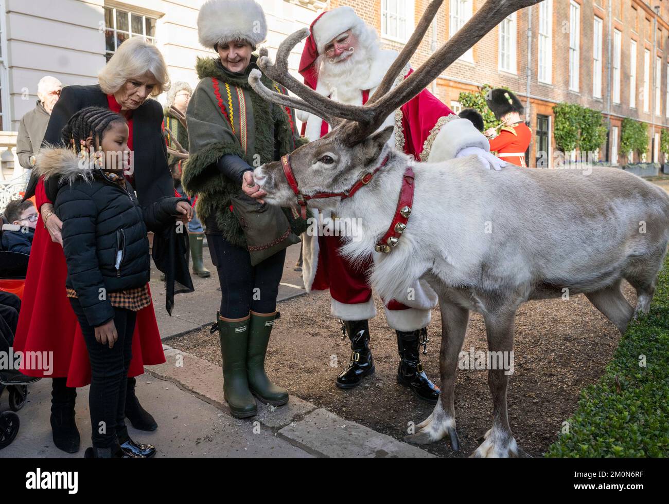The Queen Consort (second left) and Mayann MacNeil-Thompson, seven ...