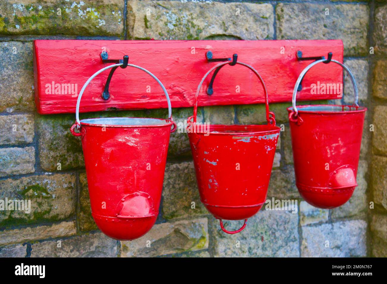 Three red fire buckets at Embsay Railway Station, Embsay, Skipton ...