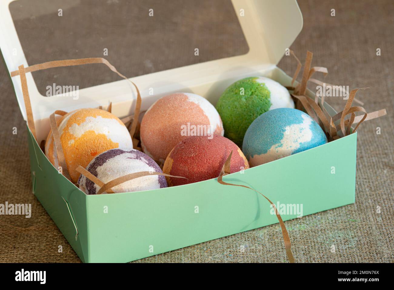 Carton box with bath bombs on table Stock Photo - Alamy