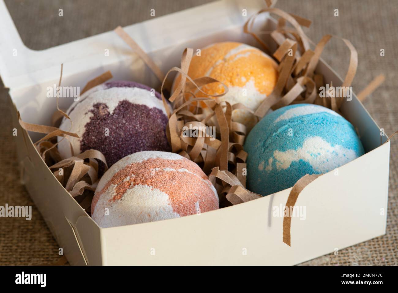 Carton box with bath bombs on table Stock Photo - Alamy