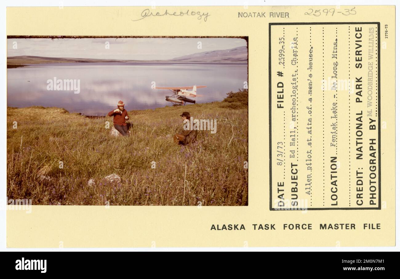 Ed Hall, archeologist, Charlie Allen, pilot at site of a men's house ...
