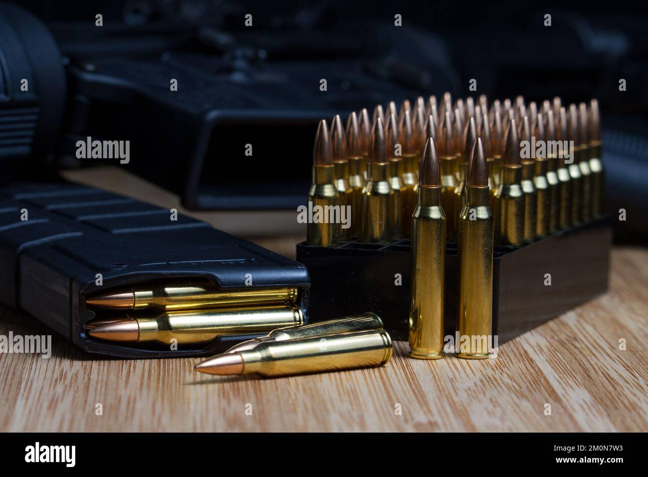 Various 223 (5.56x45mm) ammunition bullets in a loaded magazine next to ...