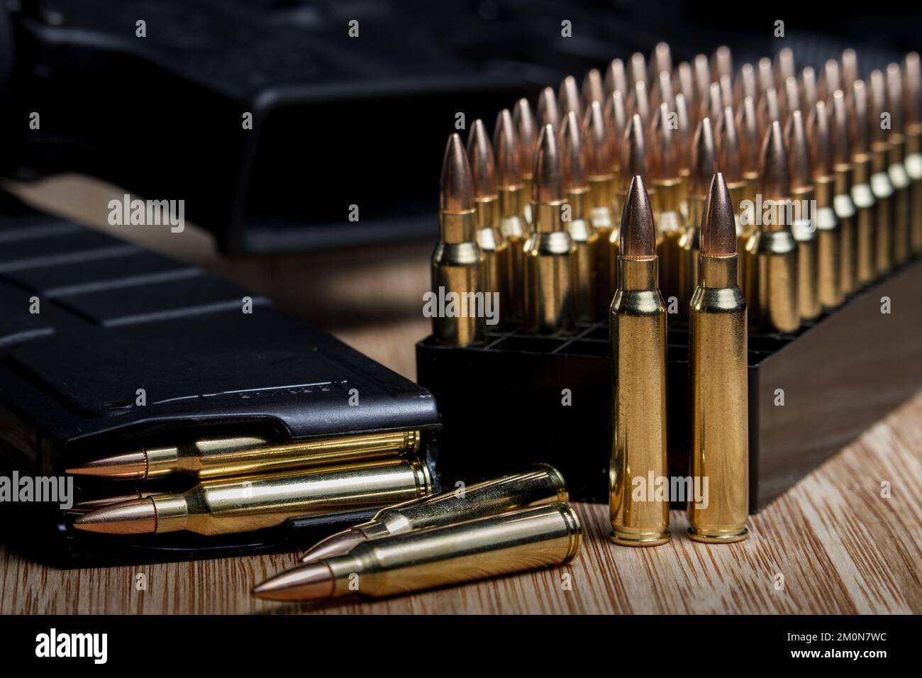 Various 223 (5.56x45mm) ammunition bullets in a loaded magazine next to ...